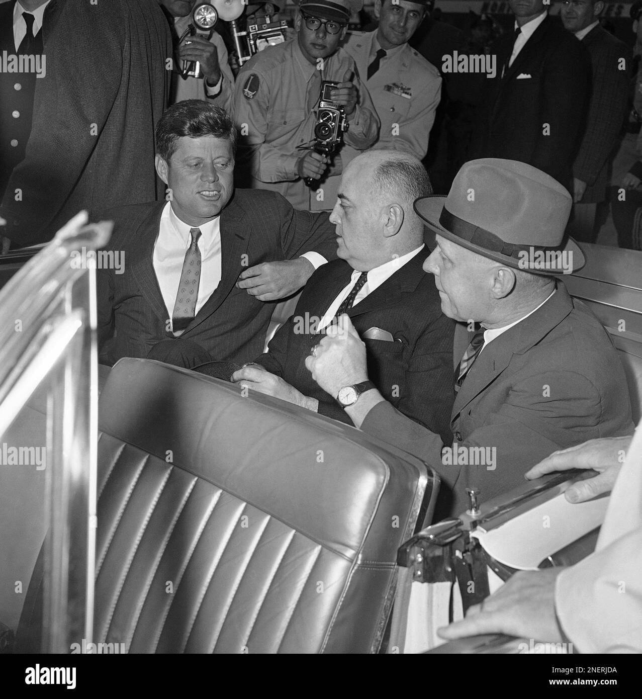President John Kennedy talks with District Judge James Mellen (center ...