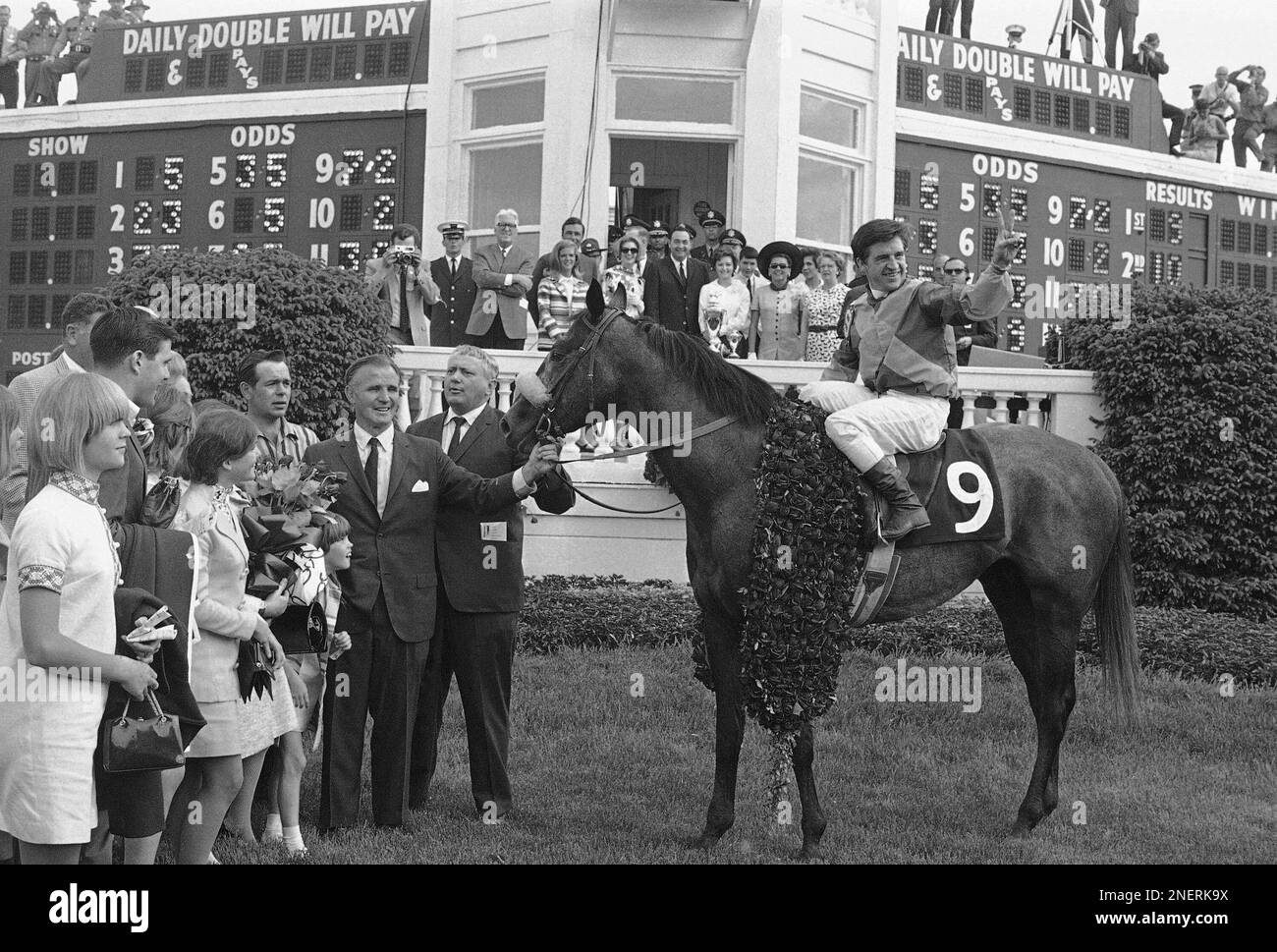 Jockey Bob Ussery sits atop Dancer?s Image in the winners circle at ...