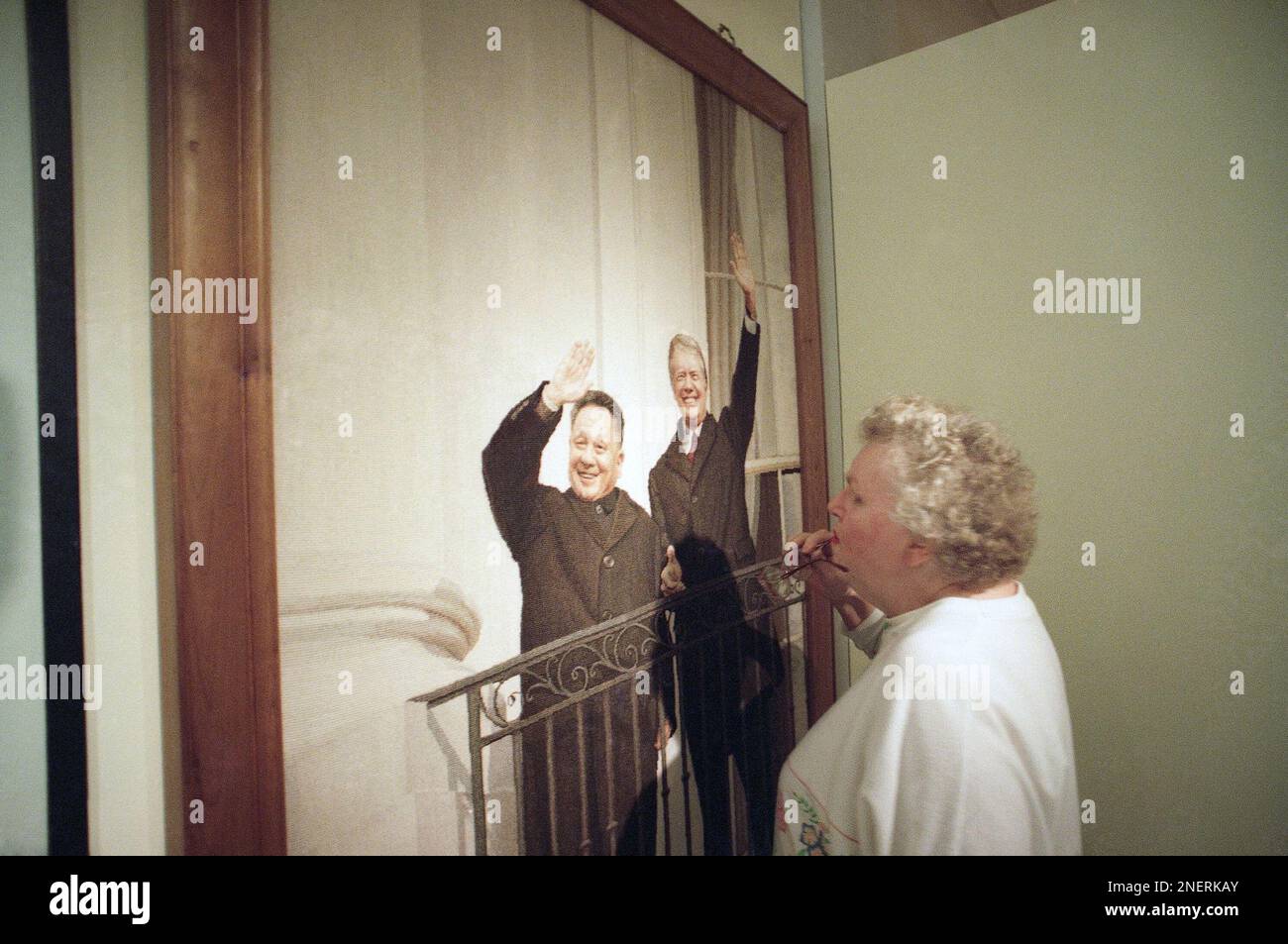 Jean Ollis of Los Angeles looks at a needlepoint tapestry, Feb. 19 ...
