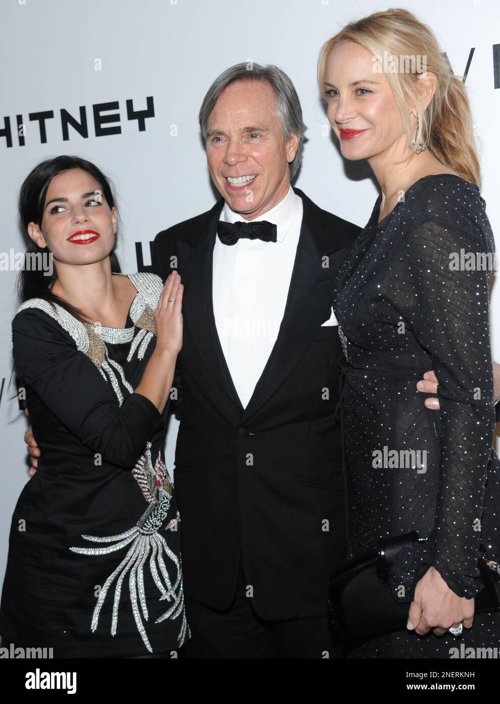 From left, Ally Hilfiger, designer Tommy Hilfiger and wife Dee Hilfiger ...