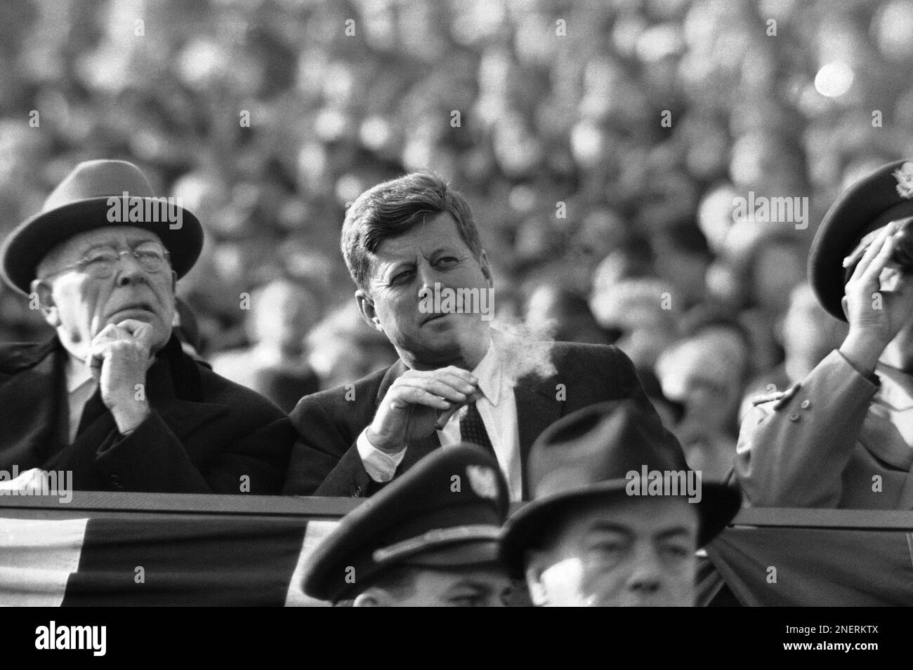 President John Kennedy enjoys smoke as he sits in his seat on Dec. 2 ...