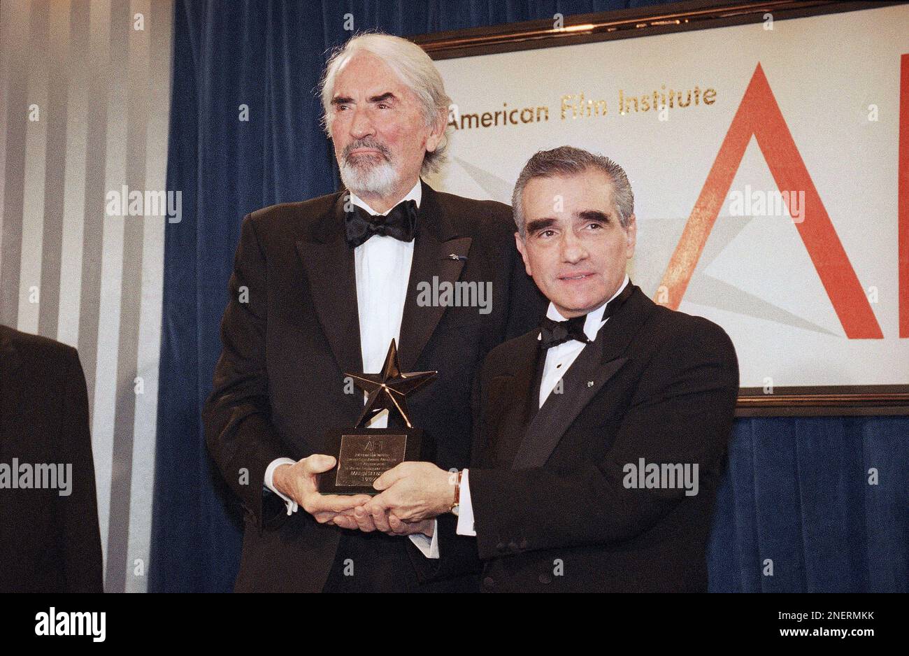 Standing holding trophy smiling fame achievement hi-res stock ...