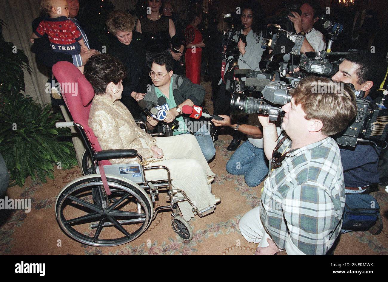 Actress Annette Funicello, left, is besieged by news media during a ...