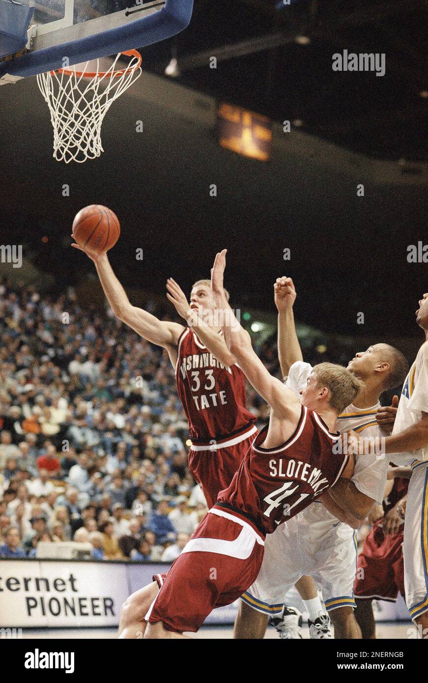 Washington State?s Isaac Fontaine attempts to stop a shot by UCLA?s ...