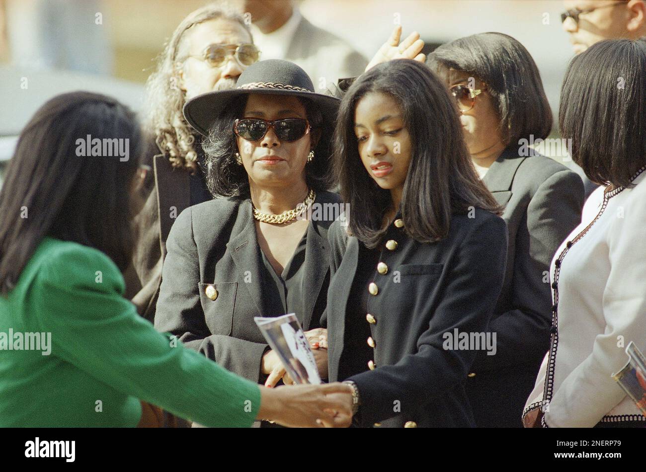 A mourner gives her condolences to Curt Flood?s widow, Judy Pace-Flood ...