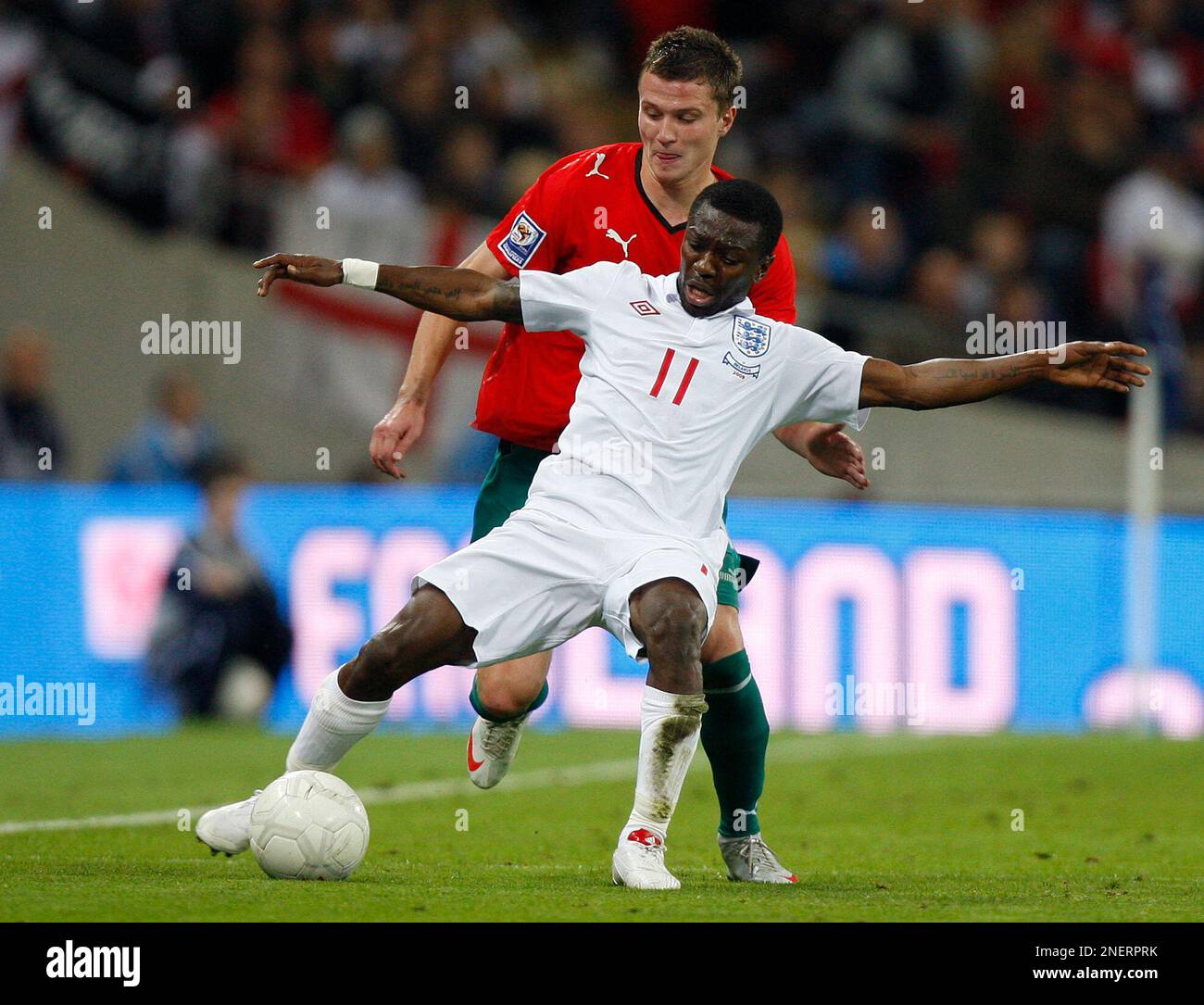 England's Shaun Wright-Phillips, front, competes with Belarus' Igor ...