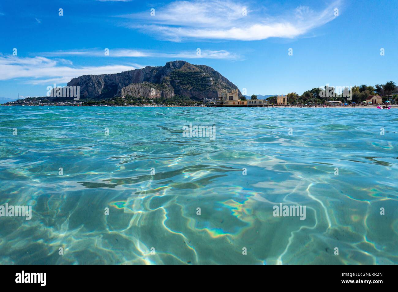 The beautiful crystal clear waters of sandy Mondello Beach in the ...