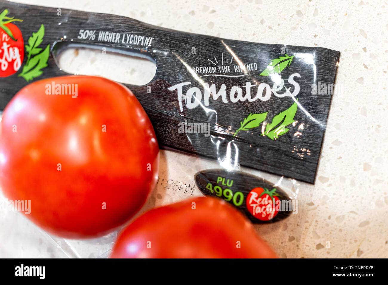 Naples, USA - January 30, 2022: Red tomatoes, vine ripened fruit with ...