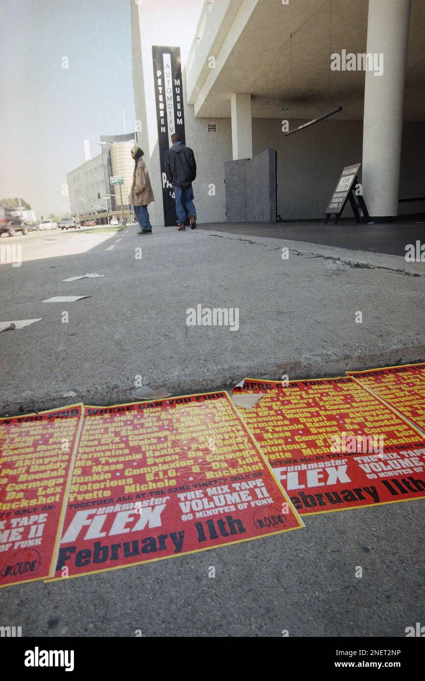 Posters littered with broken glass, announcing an earlier event that ...