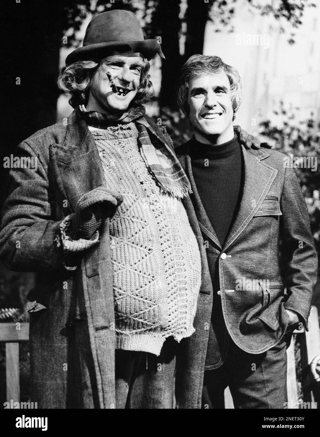 British screen actor Roger Moore, left, gets together with American ...