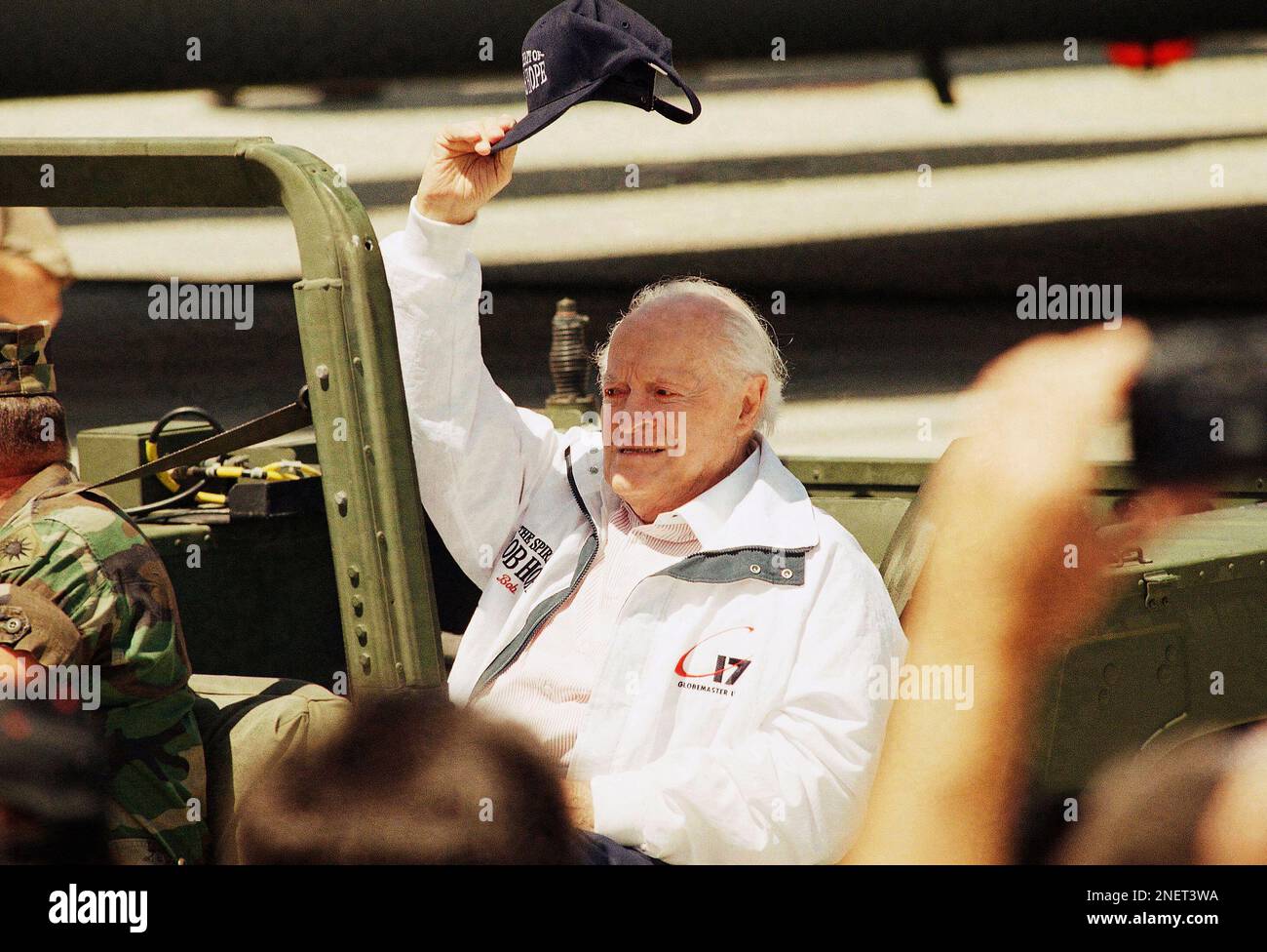 Comedian Bob Hope waves from a Humvee as he arrives on Tuesday, April ...
