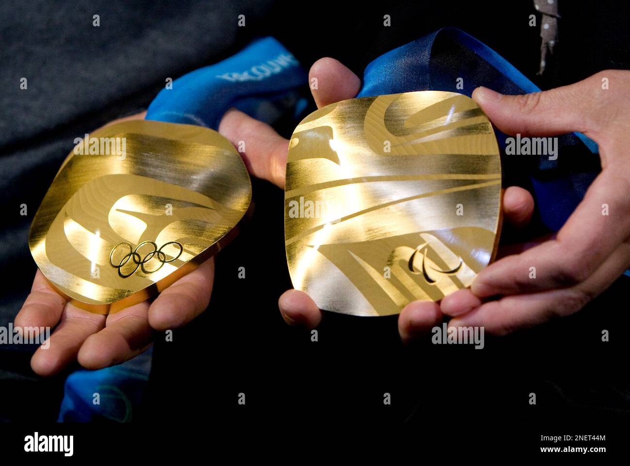 The Olympic gold medal, left, and the Paralympic gold medal, right, are ...