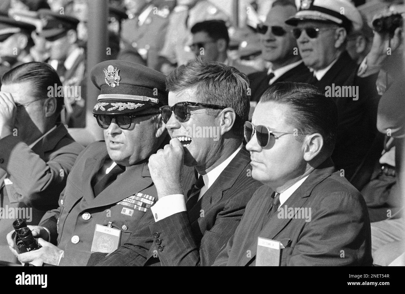 President John Kennedy watches as airborne troops demonstrate their ...