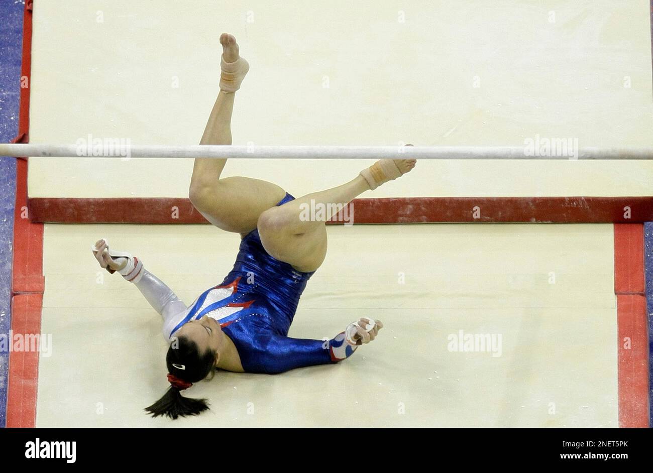 Britain's Beth Tweddle falls during her uneven bars routine during ...