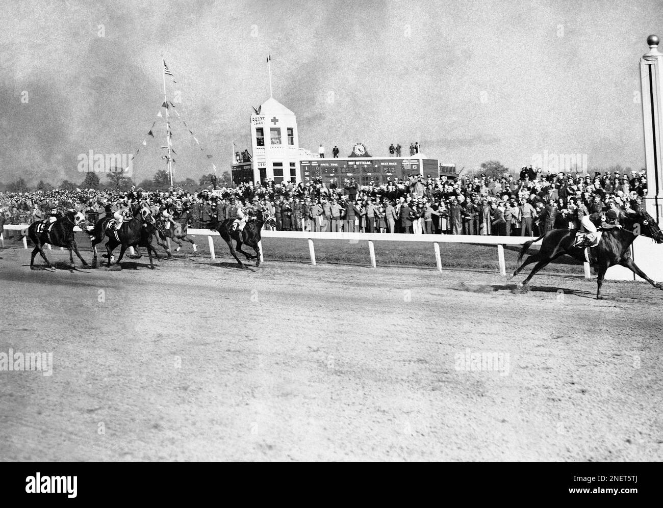 Pensive, owned by Warren Wright of Chicago, crosses the finish line to ...