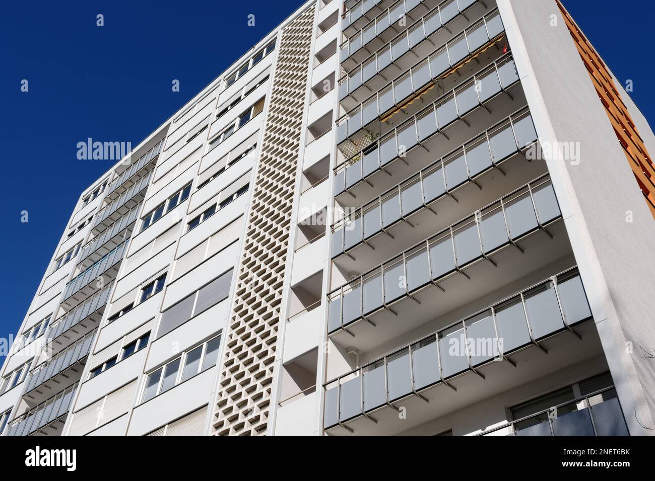 beautifully restored older white high-rise apartment building with gray ...
