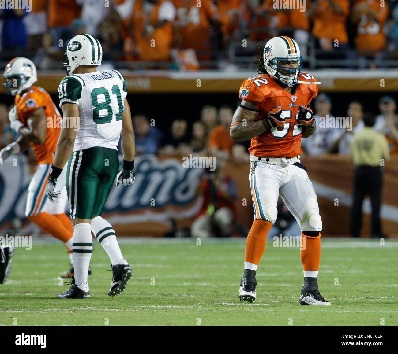 Miami Dolphins linebacker Channing Crowder, right, celebrates a tackle ...