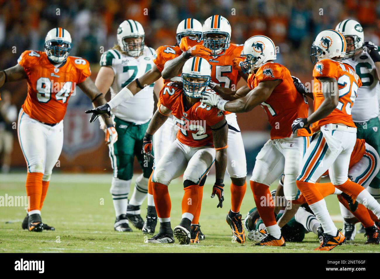Miami Dolphins linebacker Channing Crowder is congratulated by ...