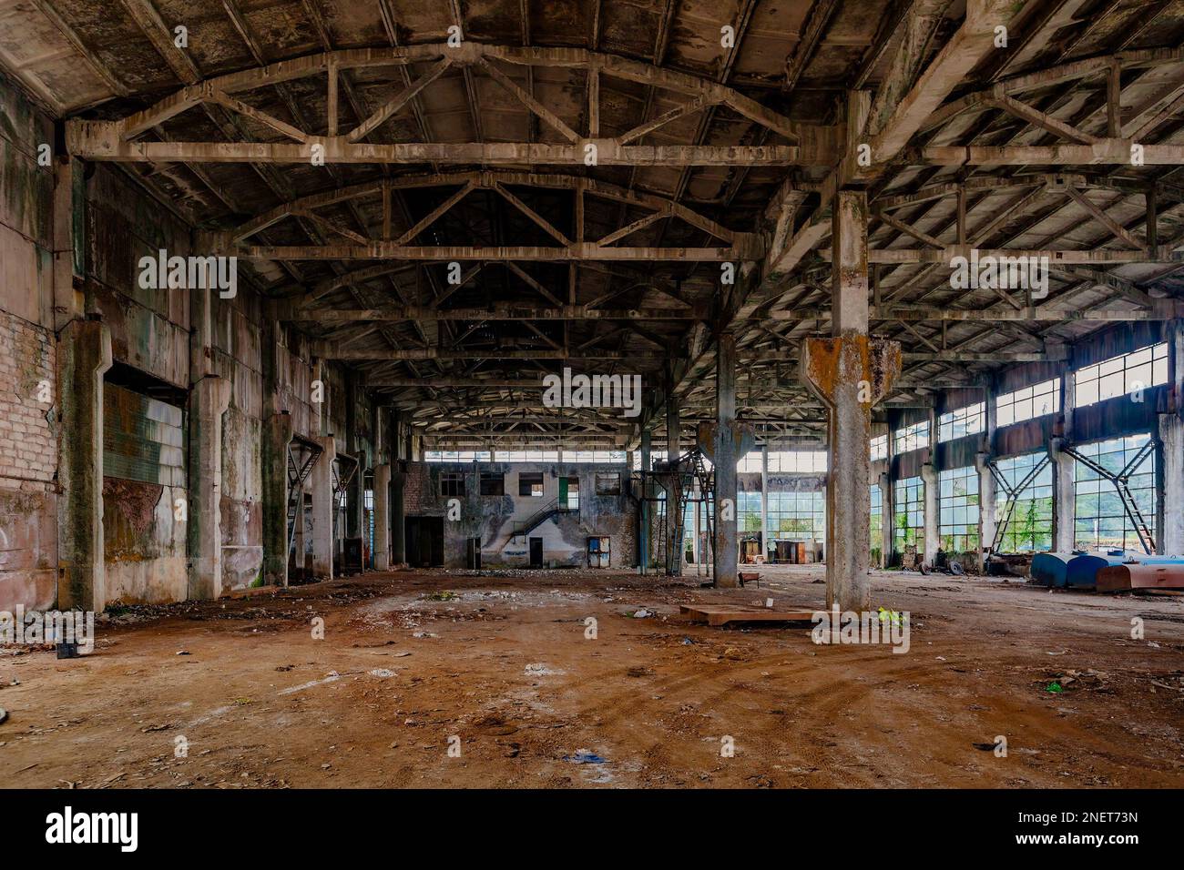 Abandoned factory. Large empty industrial hall waiting for demolition ...