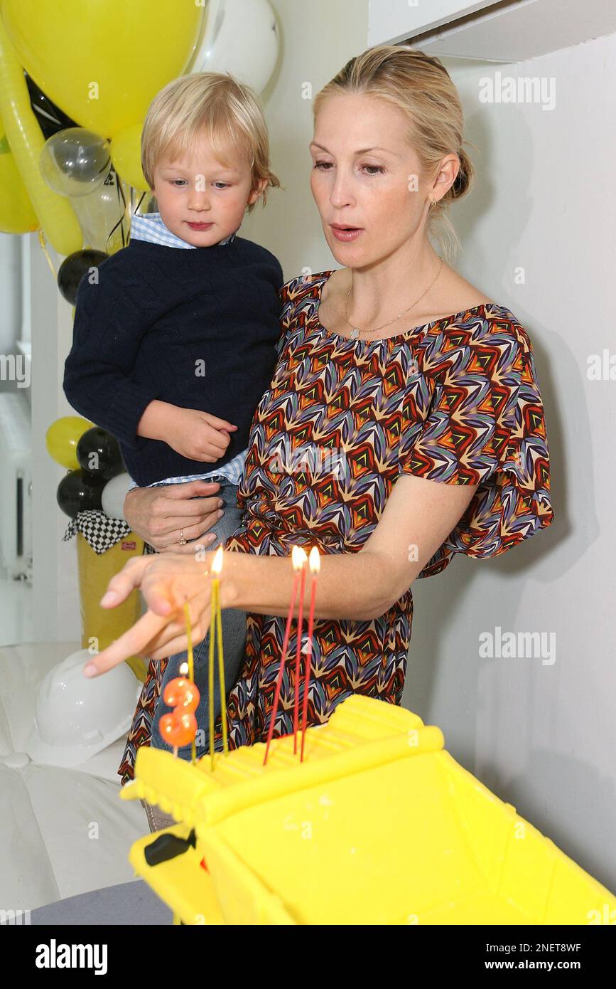 Kelly Rutherford and son Hermes attend a Rocky the Robot Truck themed ...