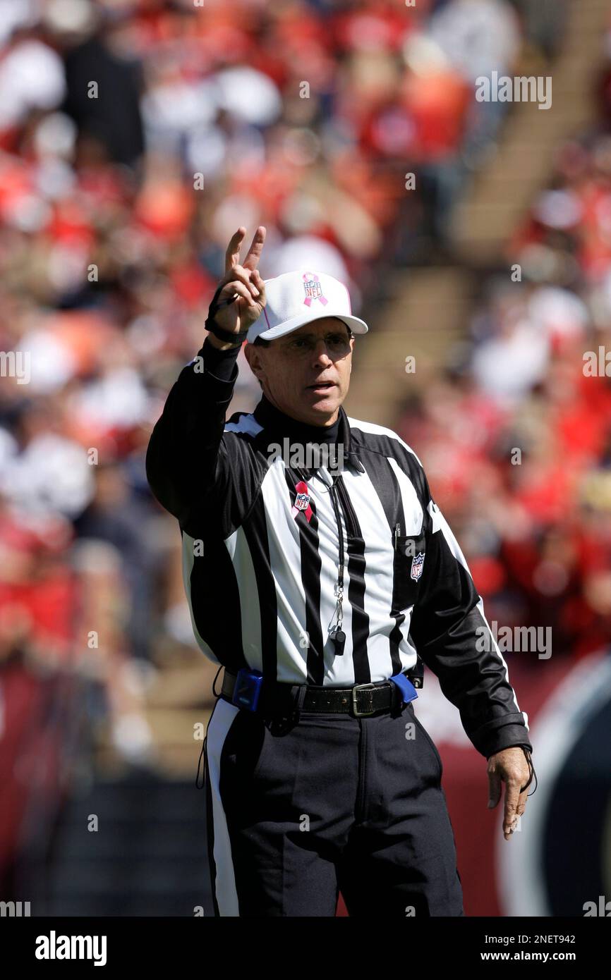 An NFL referee in action as the St. Louis Rams play the San Francisco ...