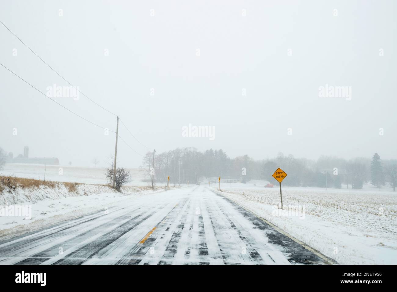 Photograph of highway traffic taken during a winter snow storm ...