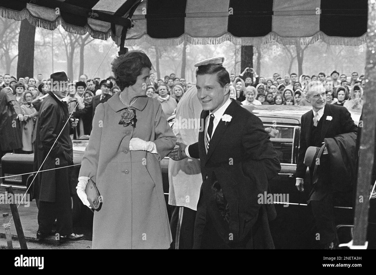 U.S. Senator Charles Percy, father of the bride, escorts Mrs. John D ...