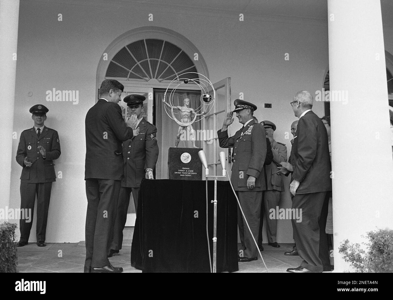 President John Kennedy applauds Air Force Gen. Thomas White and gets a ...