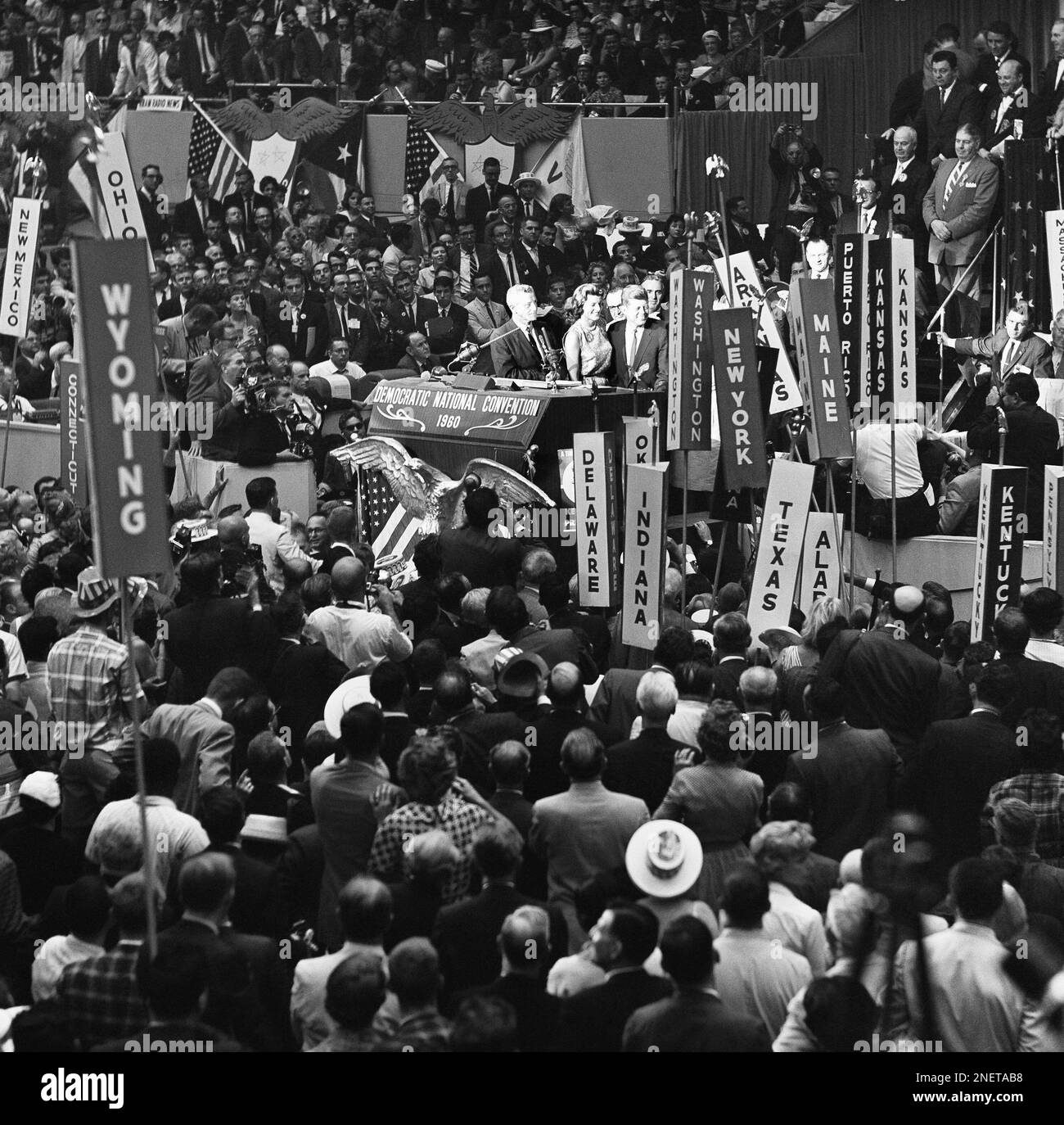 A triumphant Sen. John F. Kennedy acknowledges the cheers of Democratic ...