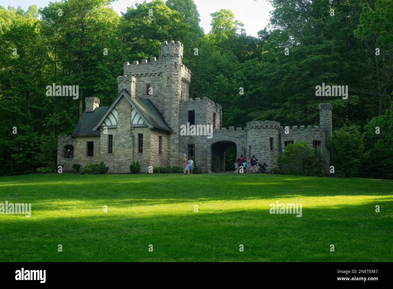 Visitors gather in front of Squires Castle, a long abandoned gatehouse ...