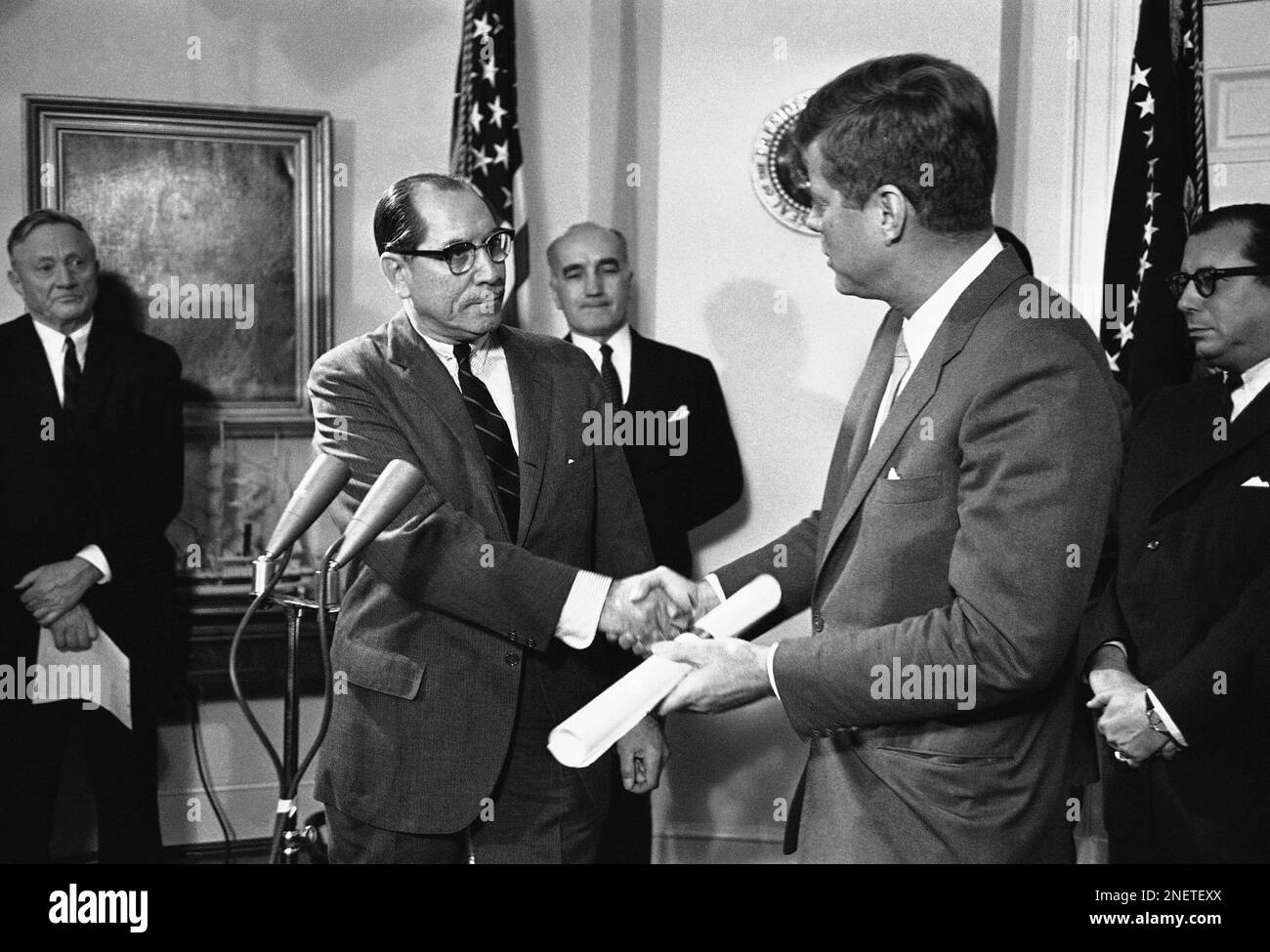 U.S. President John Kennedy congratulates Teodoro Moscoso of Puerto ...