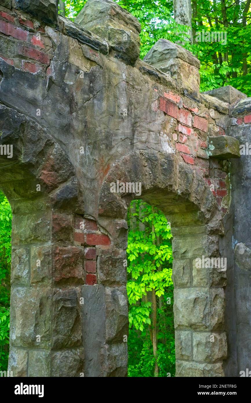 Archways in the outer wall of Squires Castle, and abandoned and fire ...
