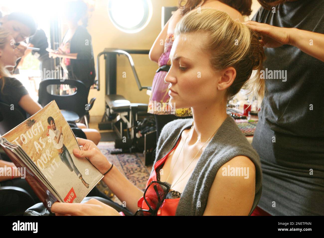 A model gets ready at the Sue Wong Spring 2010 Preview Event on October ...