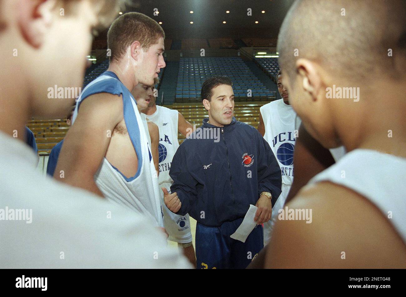 New UCLA head basketball coach Steve Lavin, center, gives instruction ...