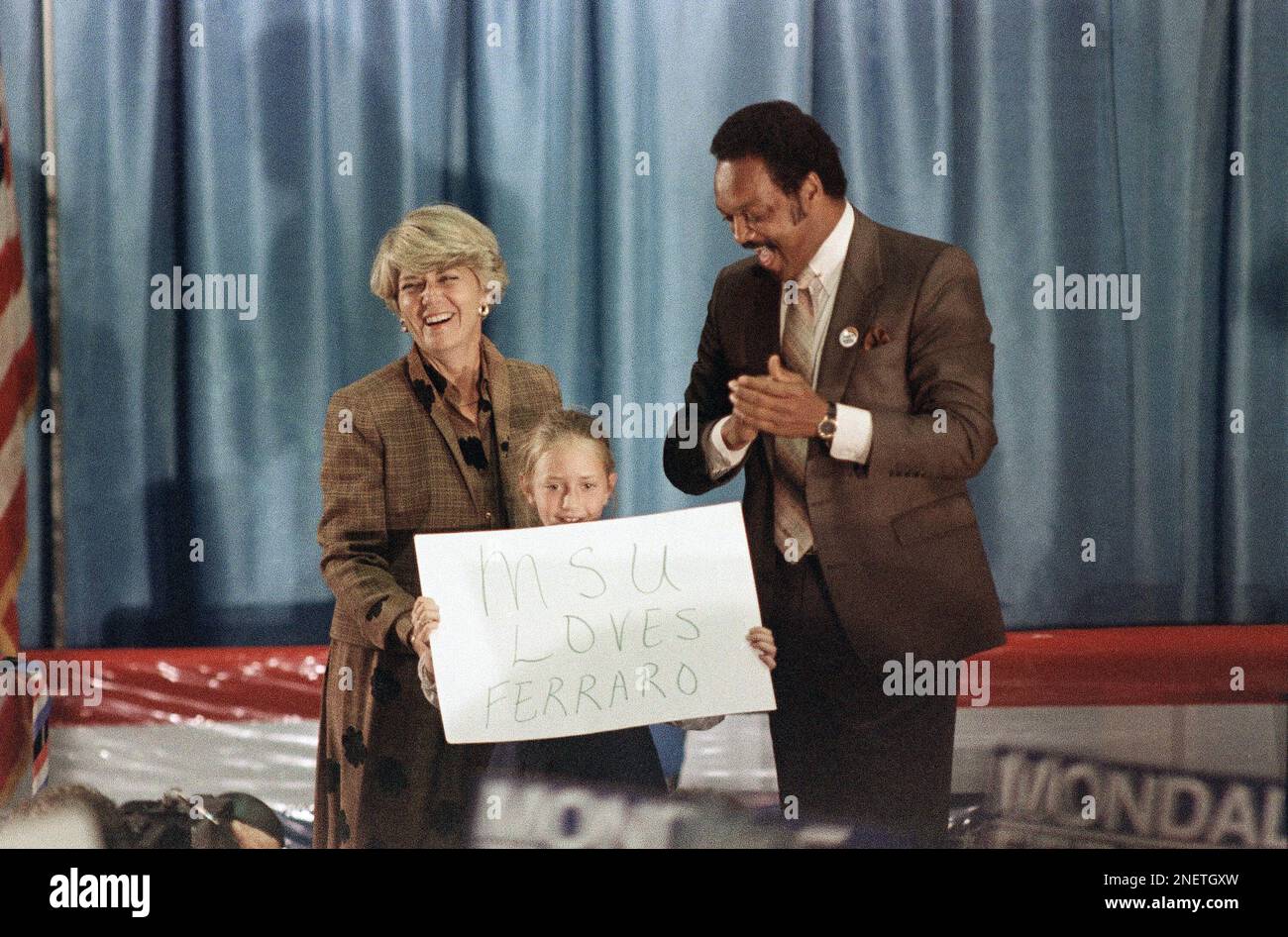 Geraldine Ferraro with Jesse Jackson and Clare Burson holding up a ?MSU ...