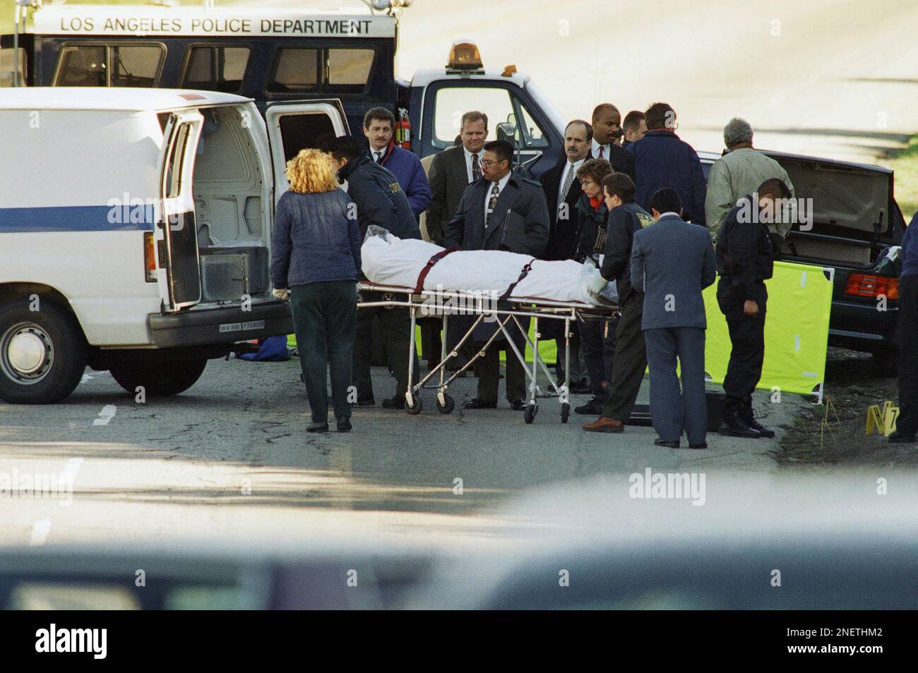 Members of the Los Angeles Police Department remove the body of Ennis ...