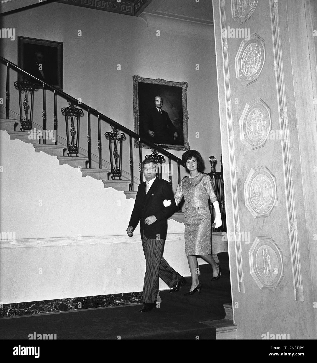 President John F. kennedy and Mrs. Jacqueline Kennedy walk down the ...
