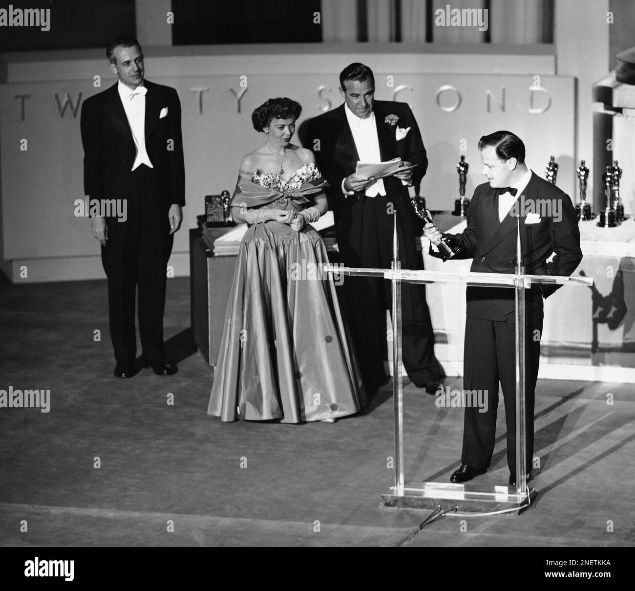 Joseph Mankiewicz admires the gold Oscar presented to him in Hollywood ...