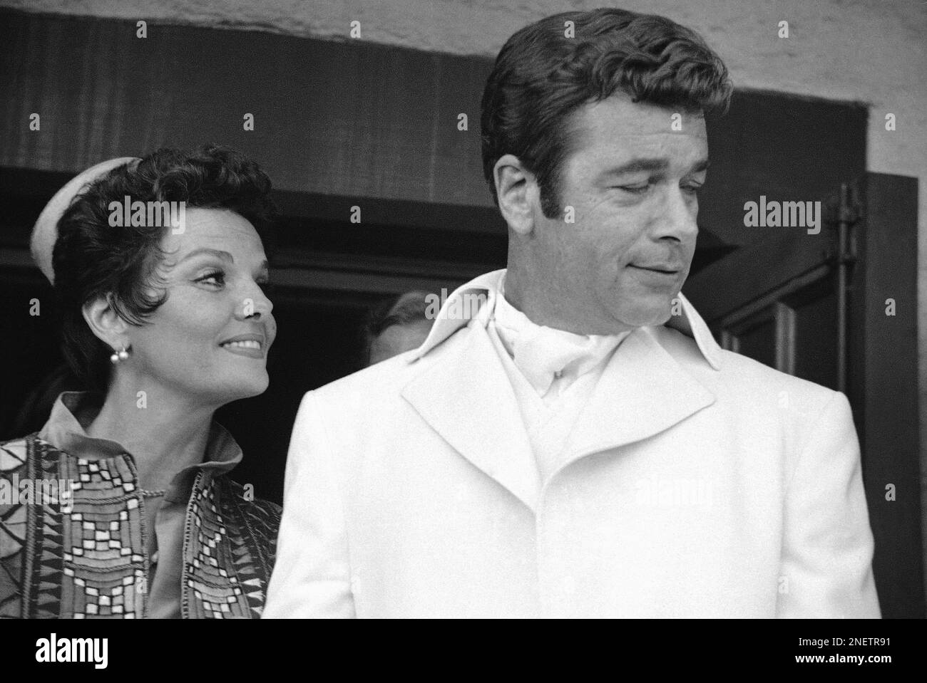 Actress Jane Russell and her bridegroom, actor Roger Barrett, pause ...