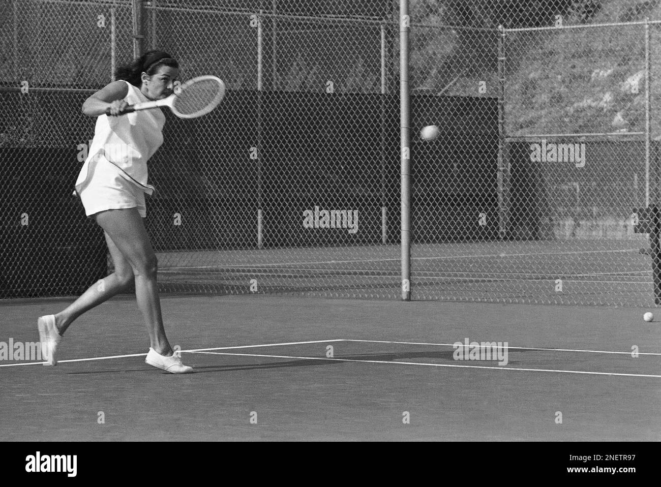 Actress Jane Russell takes tennis lessons from Gussie Moran at the Lake ...