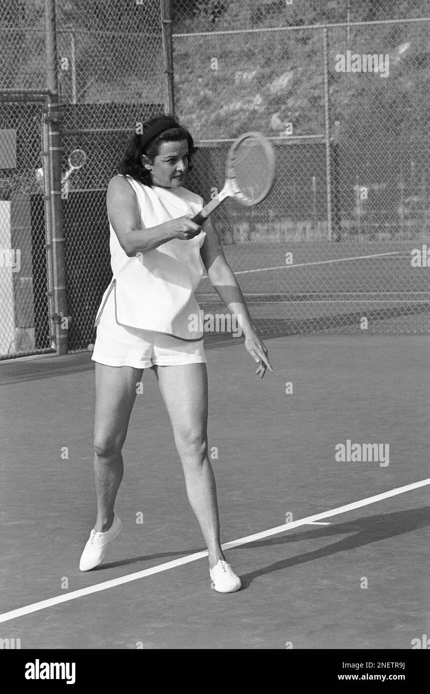 Actress Jane Russell takes tennis lessons from Gussie Moran at the Lake ...