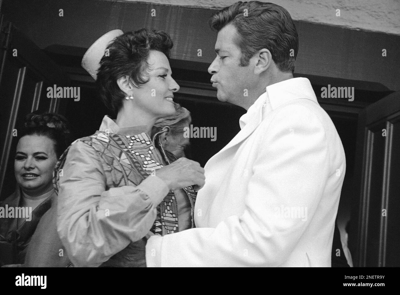 Actress Jane Russell and her bridegroom, actor Roger Barrett, pause ...