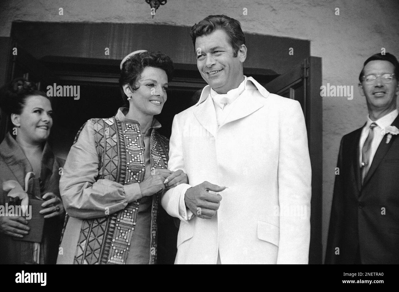 Actress Jane Russell and her bridegroom, actor Roger Barrett, pause ...