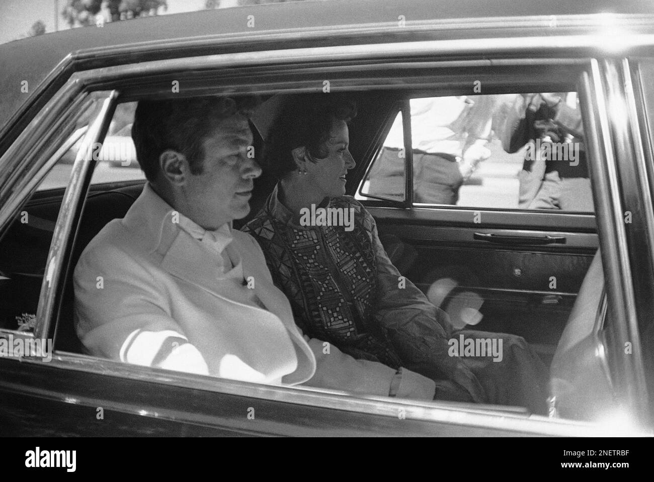 Actress Jane Russell and her bridegroom, actor Roger Barrett, sit in a ...