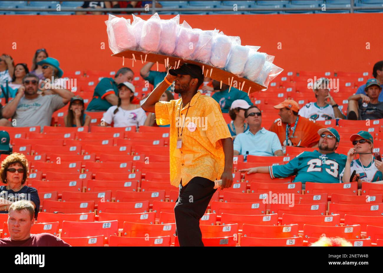 A cotton candy salesman is shown before the start of an NFL football ...
