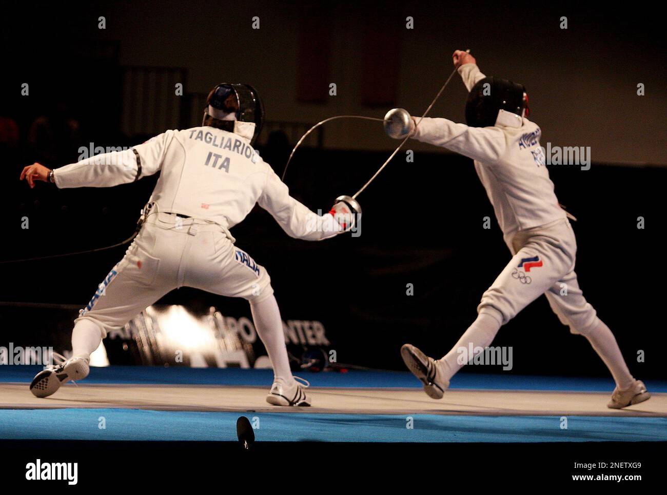 Anton Avdeev of Russia, right, and Matteo Tagliariol of Italy, compete ...