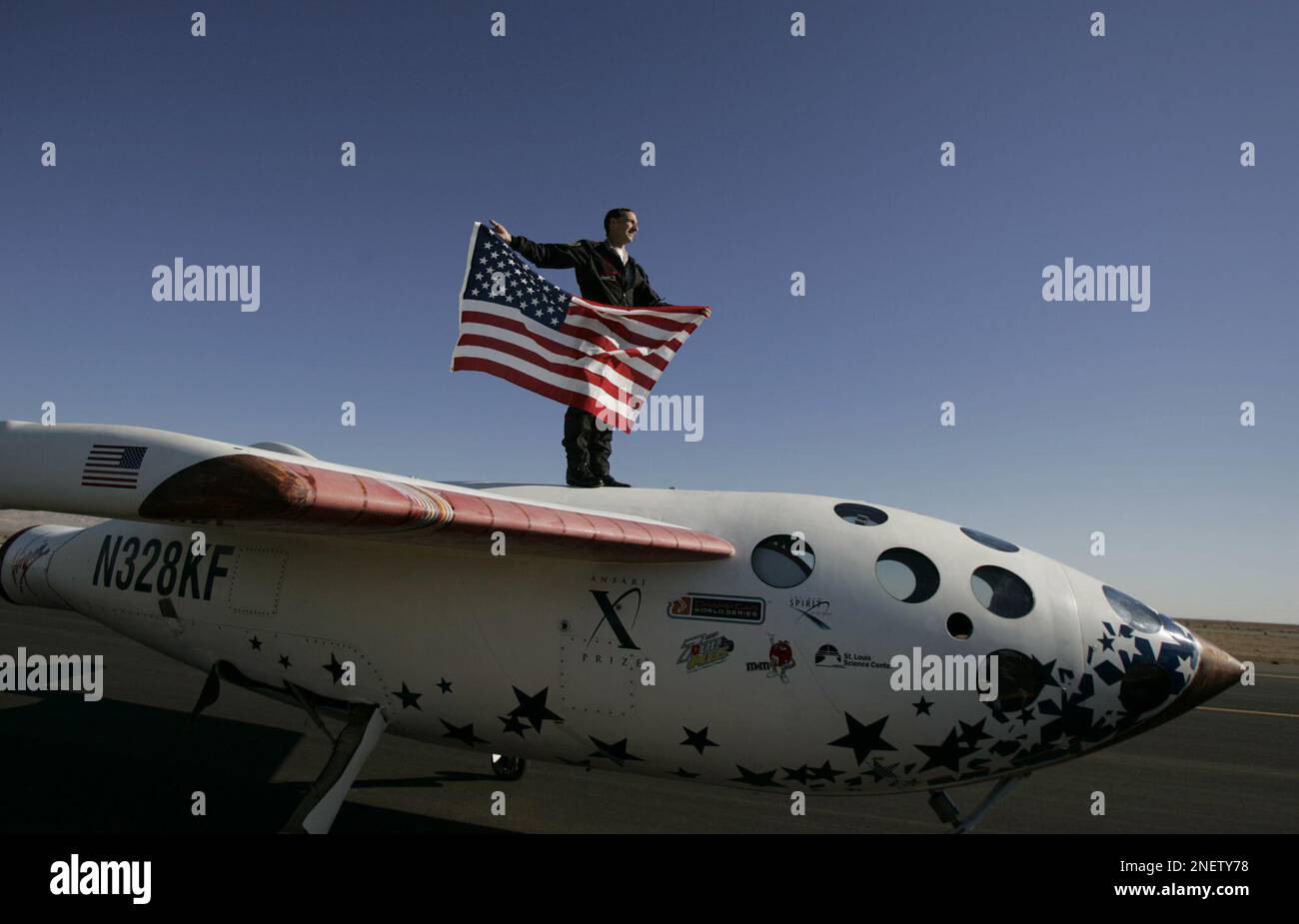 Astronaut Brian Binnie rides on SpaceShipOne after his suborbital ...