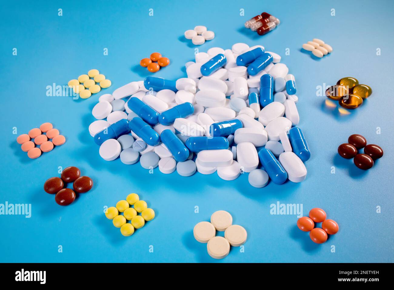 Blue white heart made of pills and capsules on a blue background. Heart ...