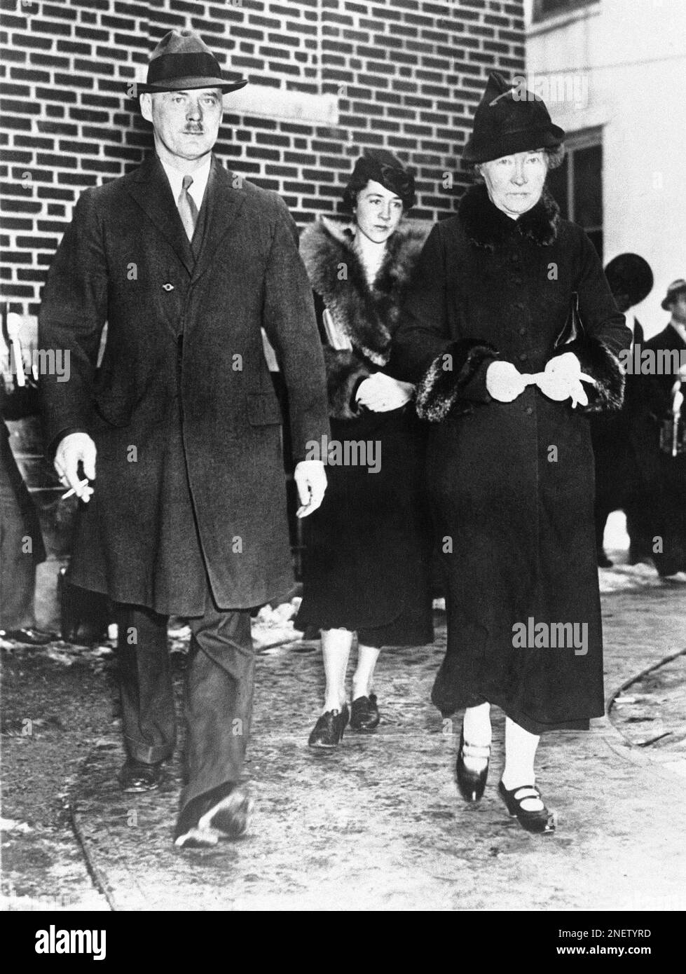 Mrs. Dwight W. Morrow (right) is shown above leaving court in ...