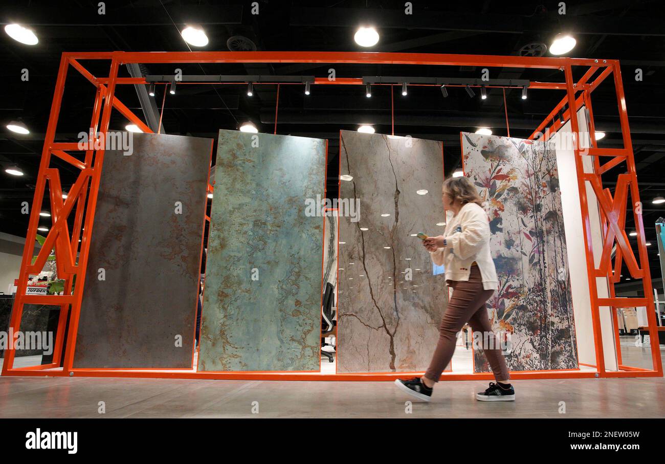 Vancouver, Canada. 16th Feb, 2023. A visitor walks past some stone wall designs at the BUILDEX ...